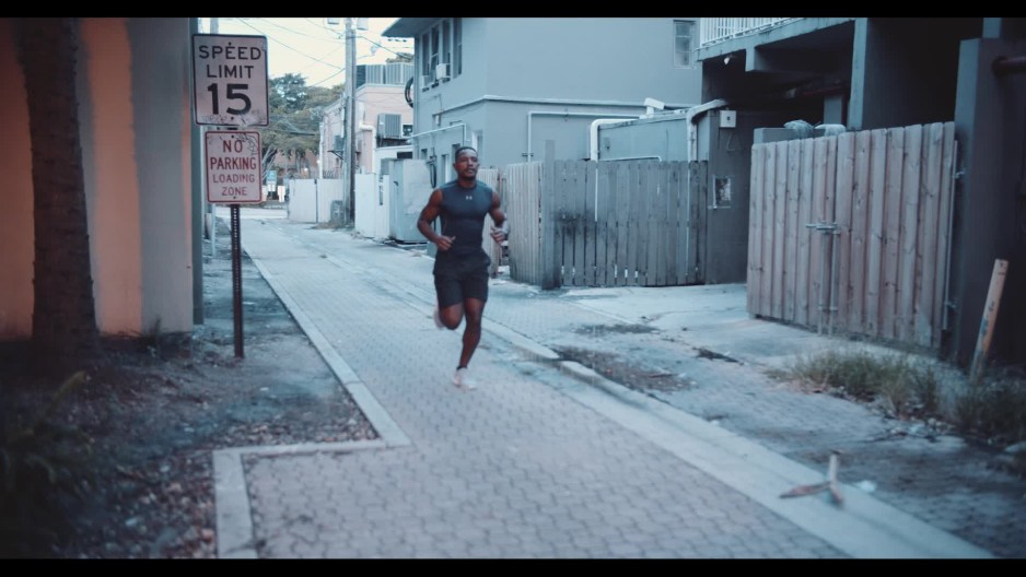Fit African American black man running down alley in urban downtown ...