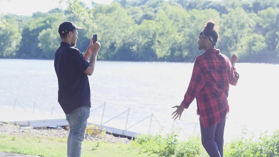Man filming for vlog outside | ClipStock