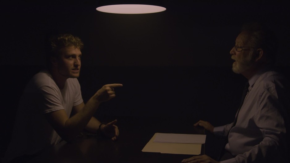 Angry Male suspect yelling at detective detained around desk in ...