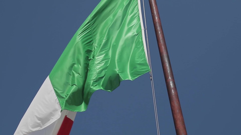 Italian flag on rusted flag pole | ClipStock