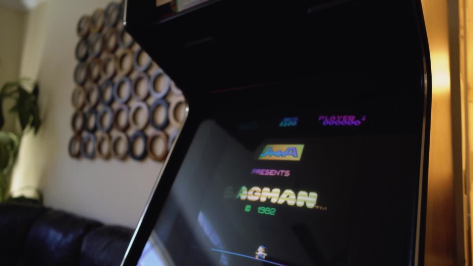 Classic arcade cabinet in building lobby | ClipStock