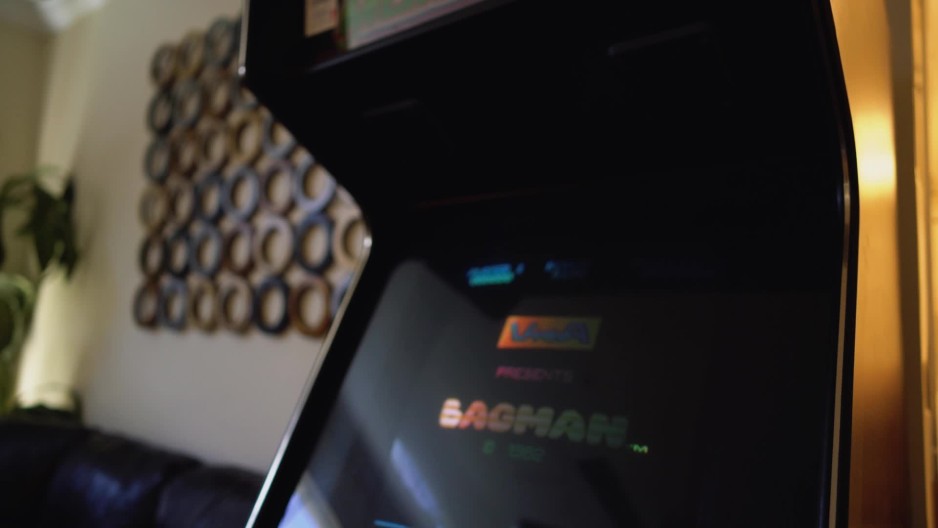 Classic arcade cabinet in building lobby | ClipStock