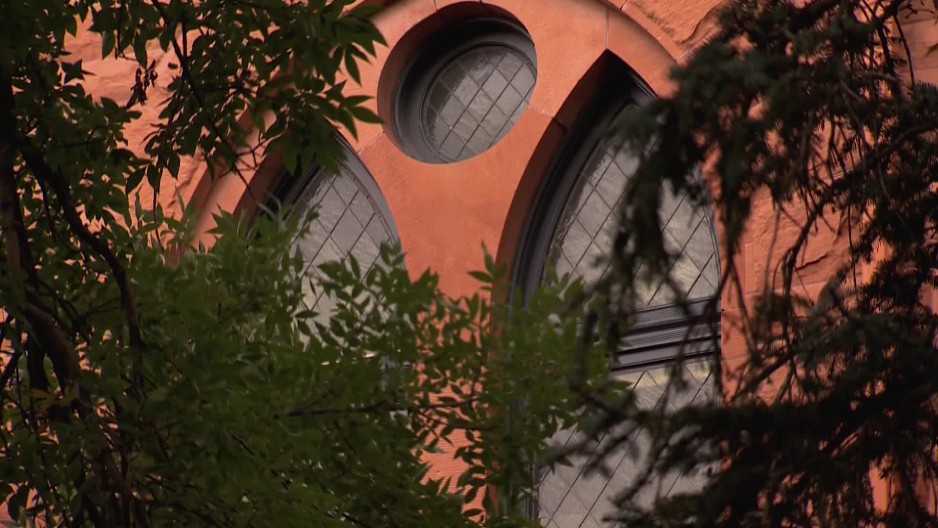 Tilt up of arched and circular windows with crosshatch design | ClipStock